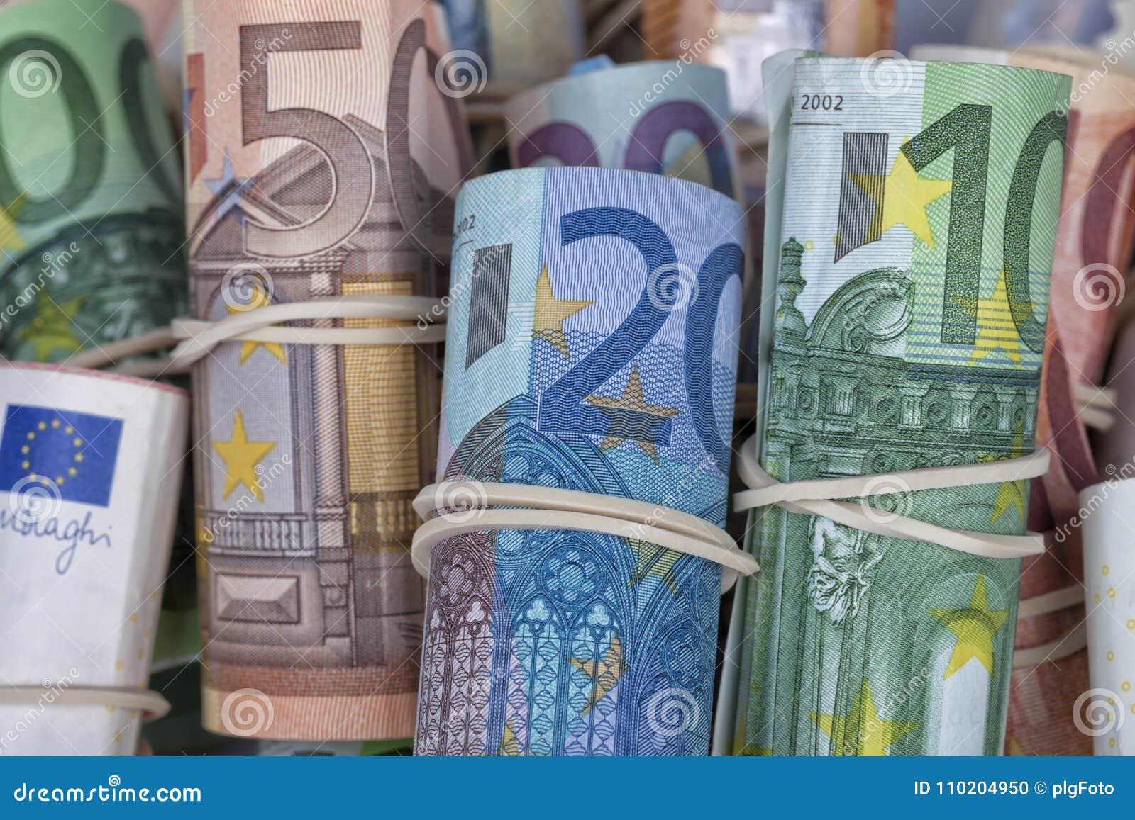 Many Euro Bills of Different Values and Rolled Stock Photo - Image of ...