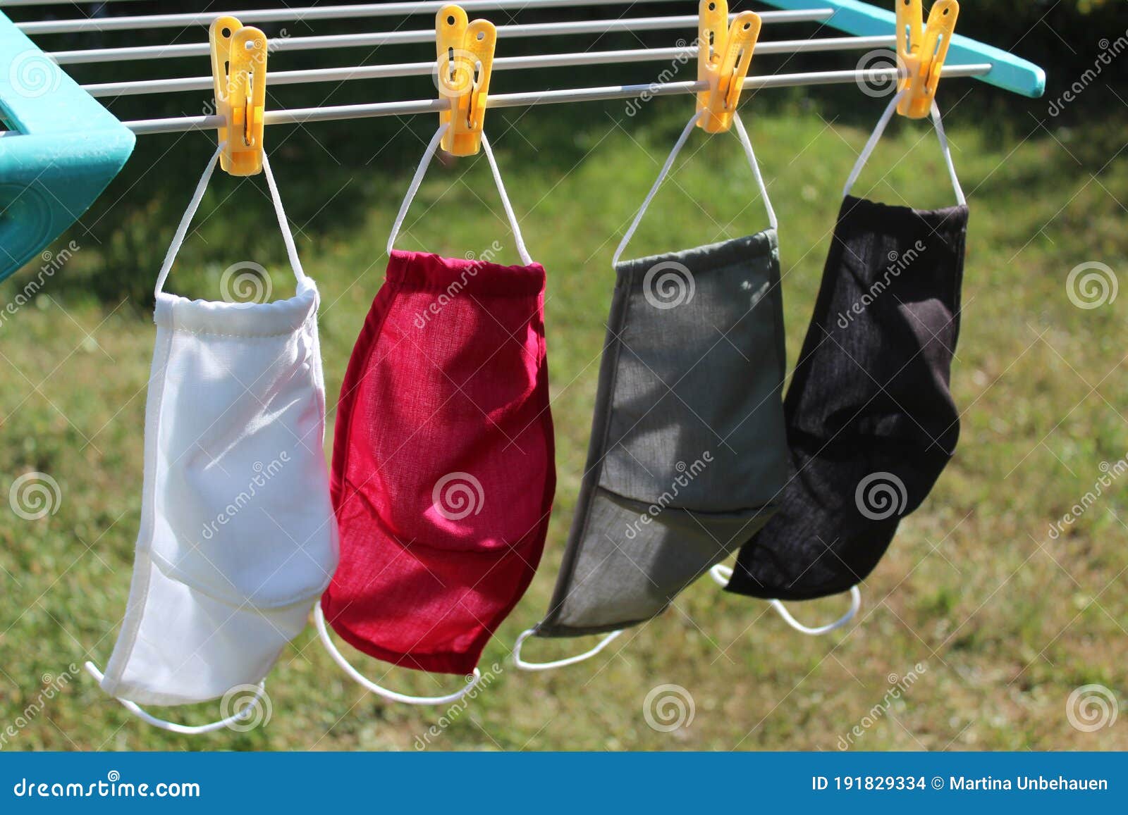 Many Face Masks on a Clothesline Stock Photo - Image of shows, masks ...
