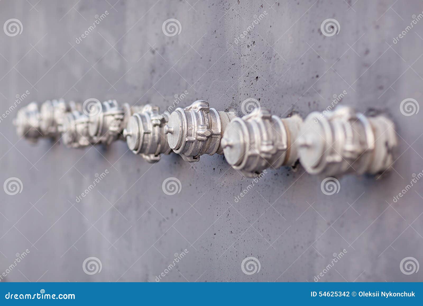 Many Fire Hydrants on Grey Wall Stock Photo - Image of steel, services ...