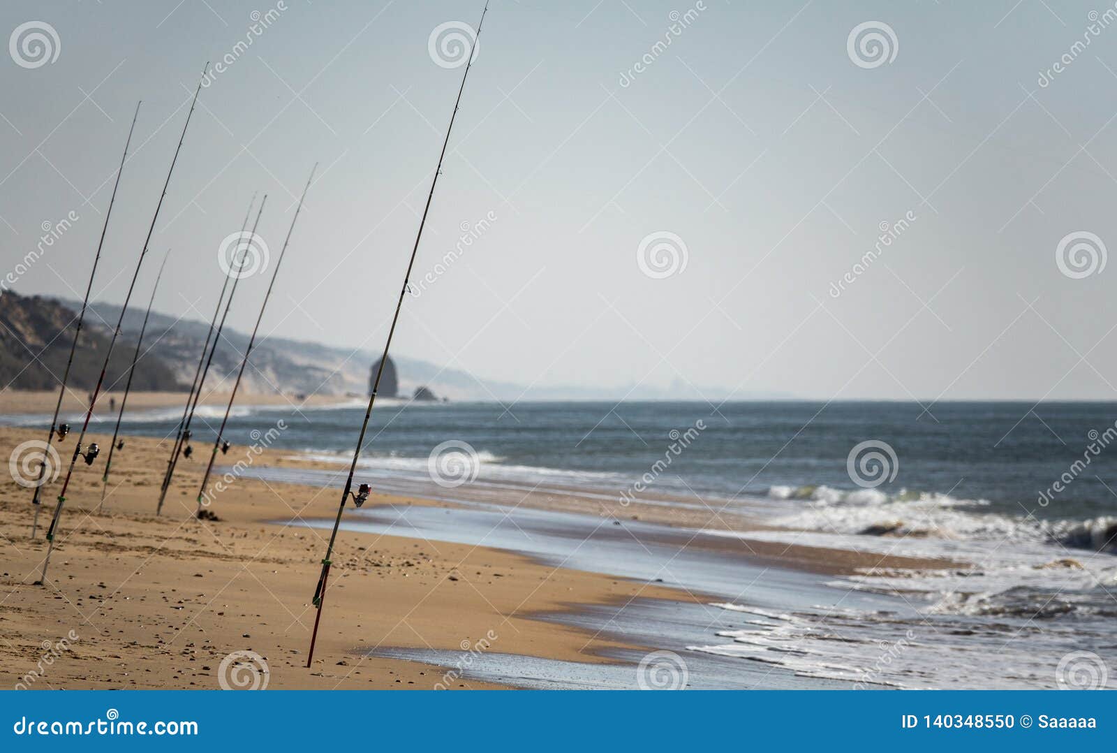 Many Fishing Rods Fishing in the Beach Stock Photo - Image of ocean ...