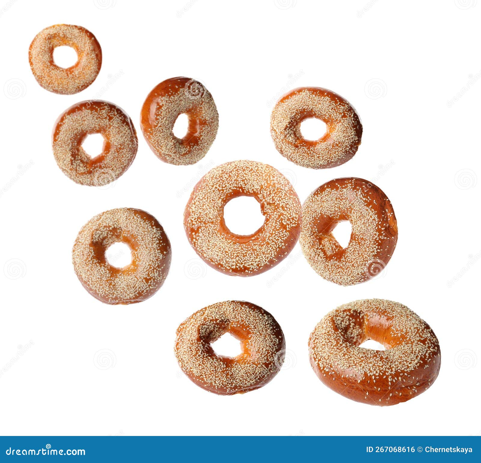 Many Fresh Bagels with Sesame Seeds Falling on White Background Stock ...