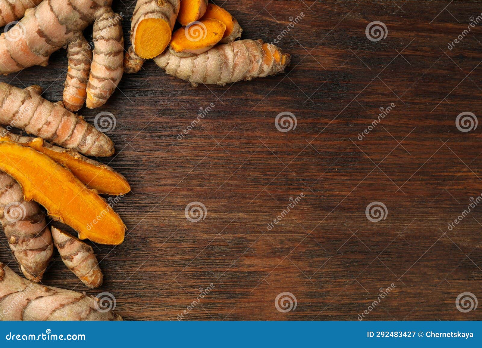 Many Fresh Turmeric Roots on Wooden Table, Flat Lay. Space for Text ...