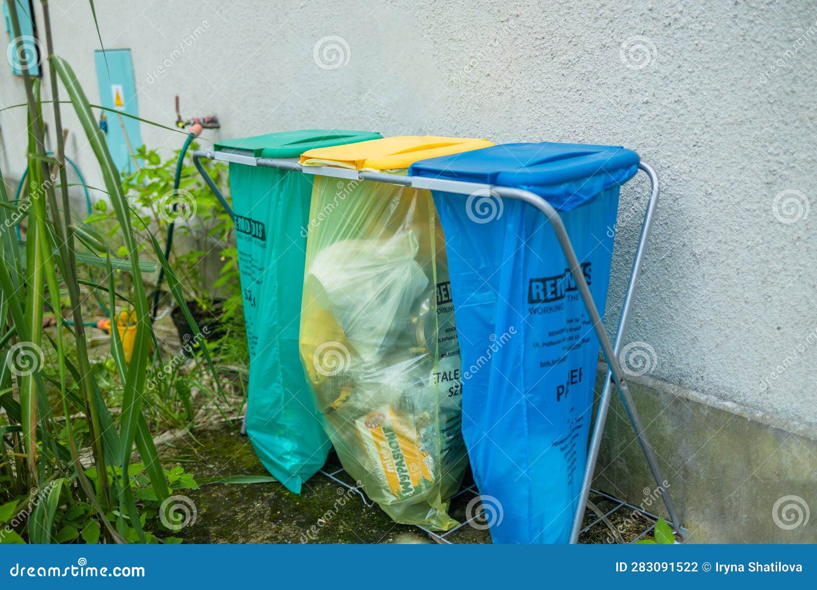 Many Garbage Cans with Sorted Garbage. Sorting Garbage. Ecology and Recycle Concept. Recycling ...