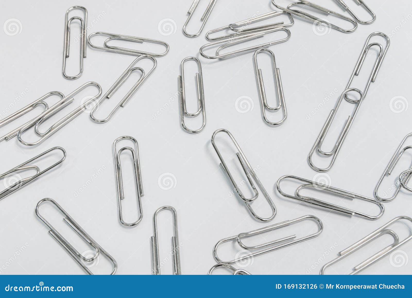 Many Gem Paper Clips are Placed on White Paper Under the Neon Lights ...