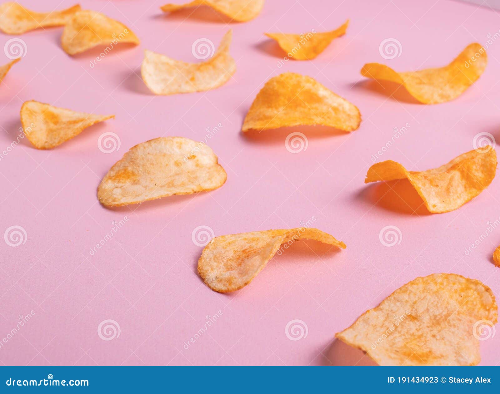 Many Golden Crisps on Pink Background Stock Image - Image of hobbies ...