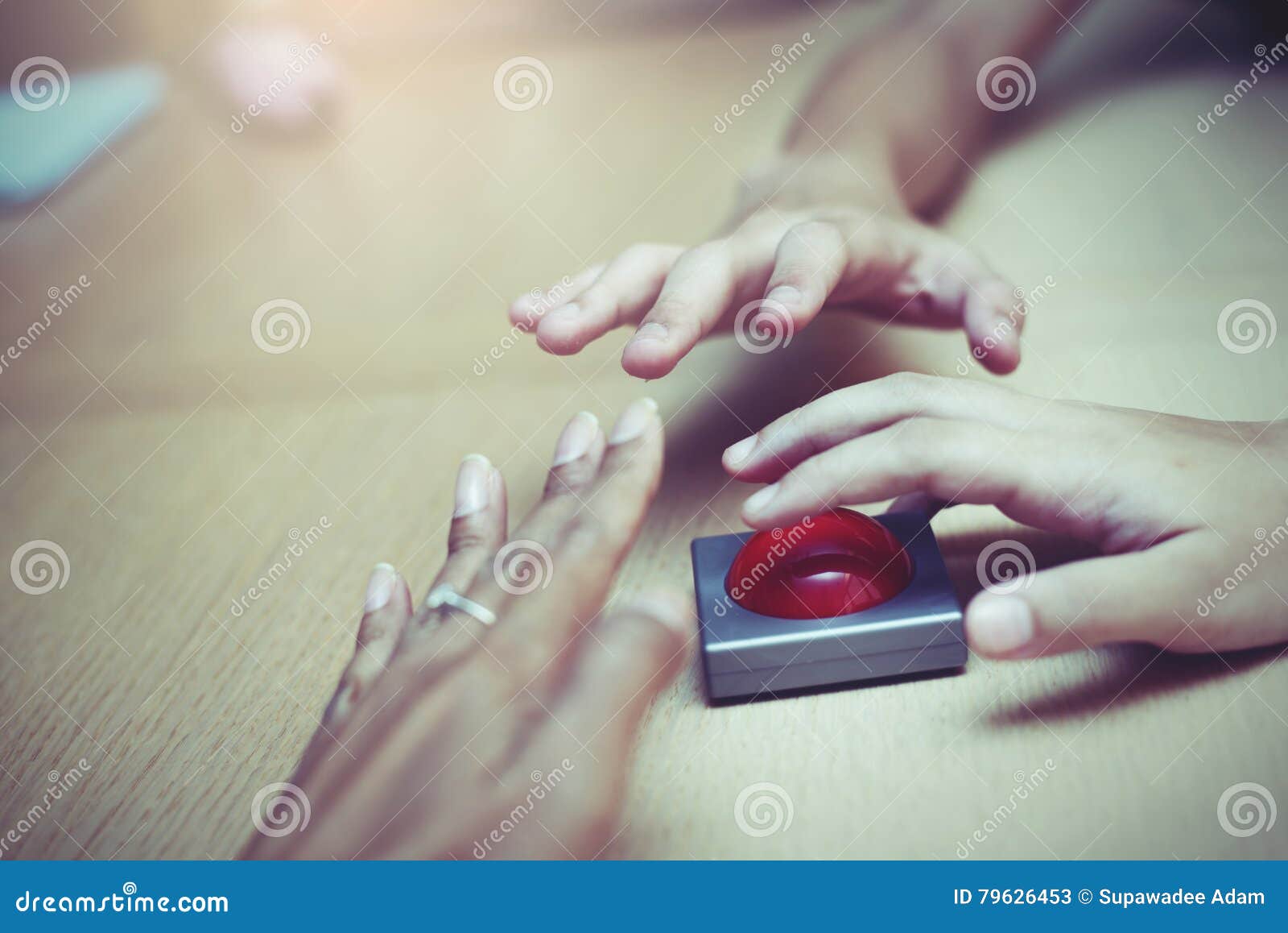 Many Hand Grab for the Red Button on Wood Table. Stock Image - Image of ...