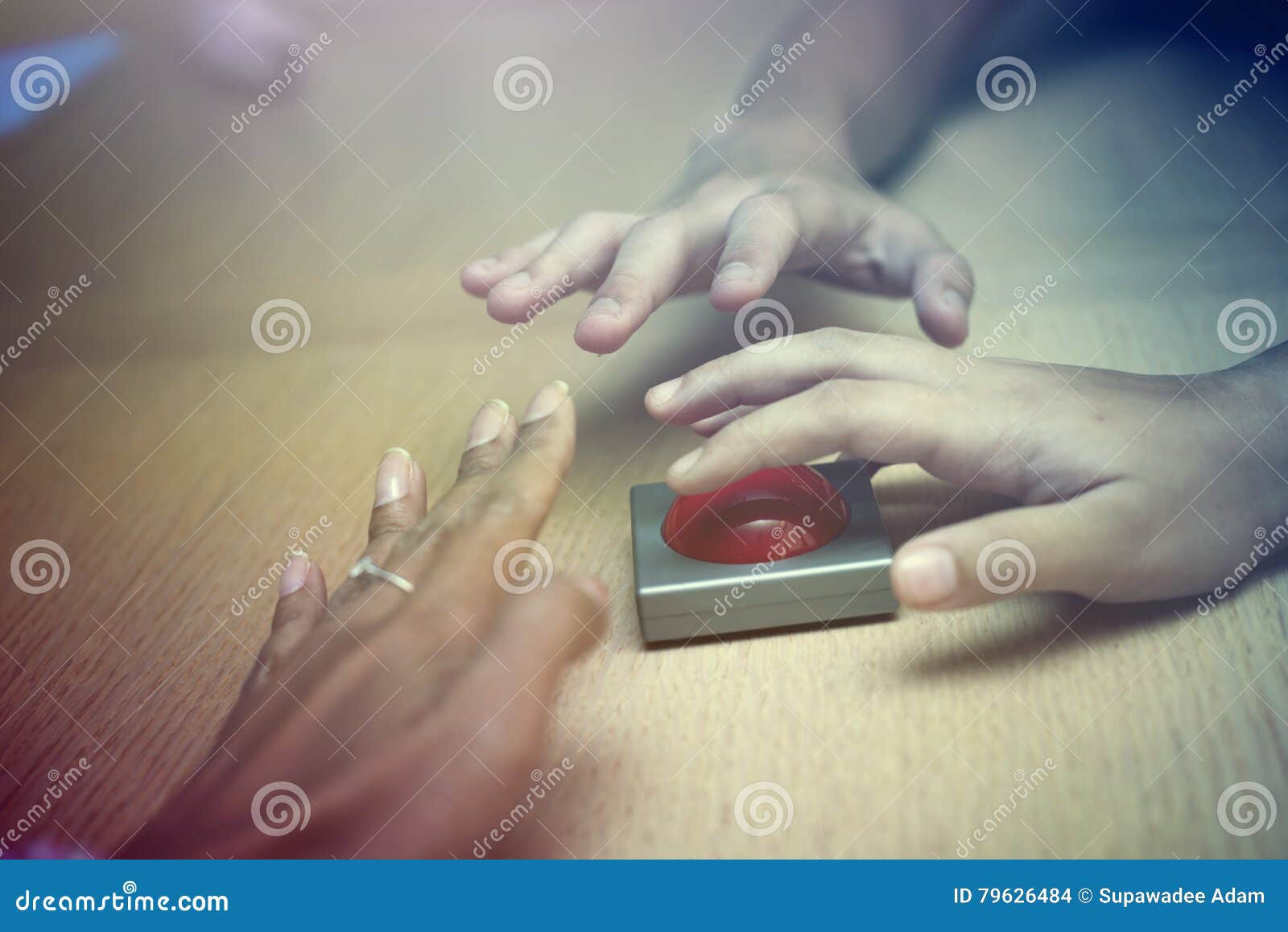 Many Hand Grab for the Red Button on Wood Table. Stock Photo - Image of ...