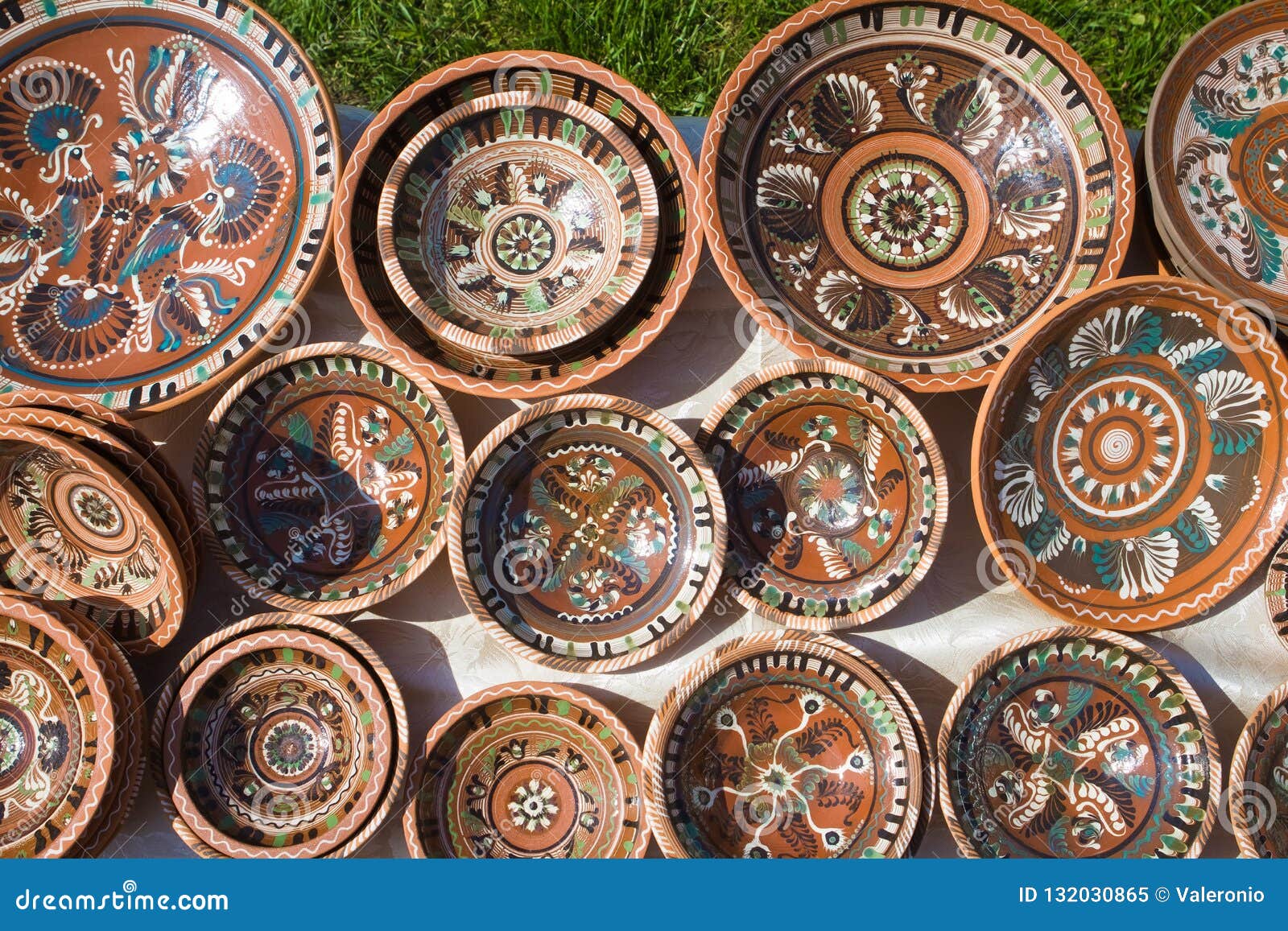 Many Handmade and Handpainted Ceramic Clay Plates with Floral and ...