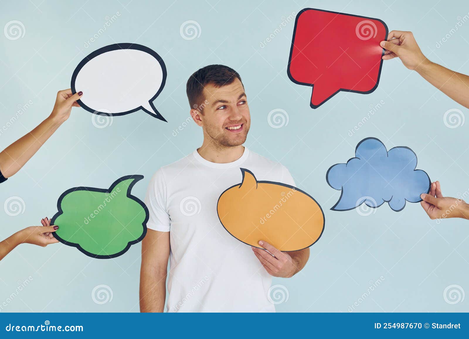 Many Hands Holding Signs. Man Standing in the Studio Stock Photo ...