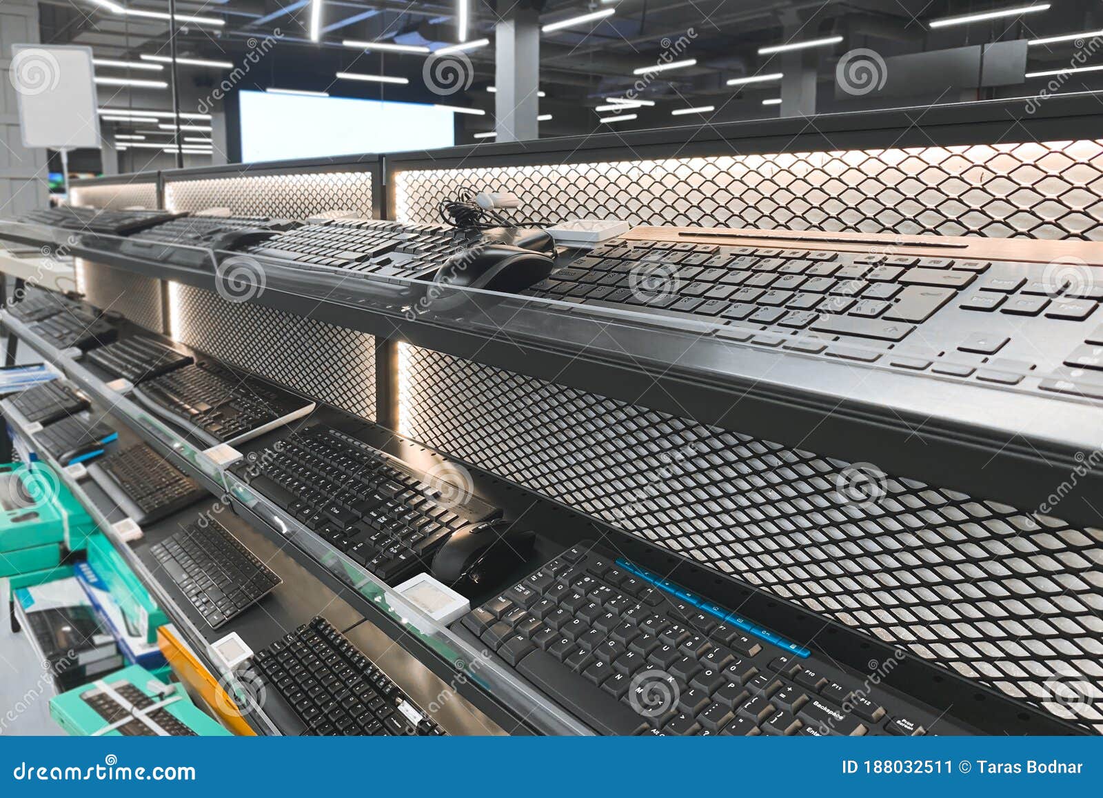 Many Keyboards in the Electronics Store. Shelves with Keyboards in the ...