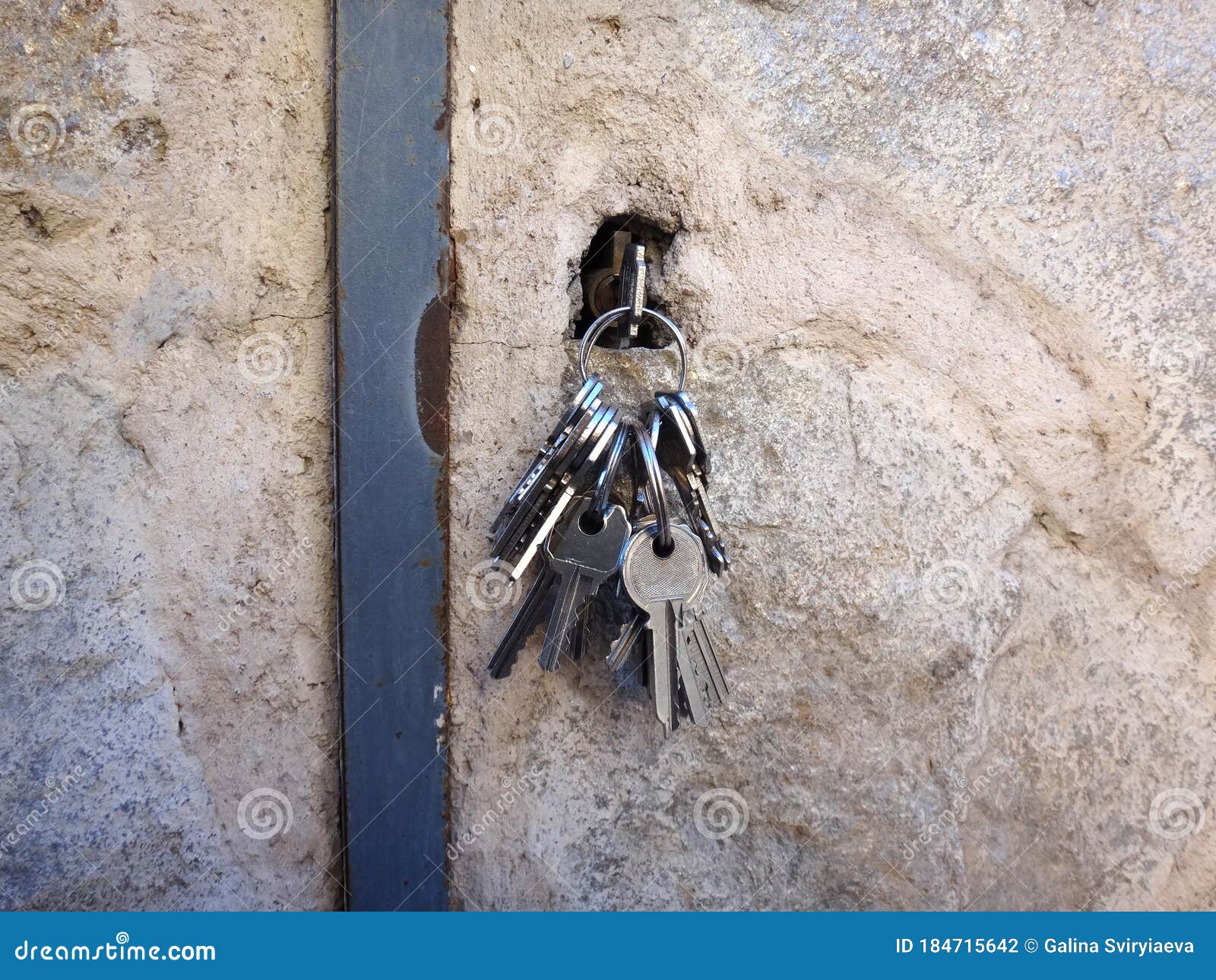 Keys in the Door Lock, a Door with a Stone Texture Stock Photo - Image ...