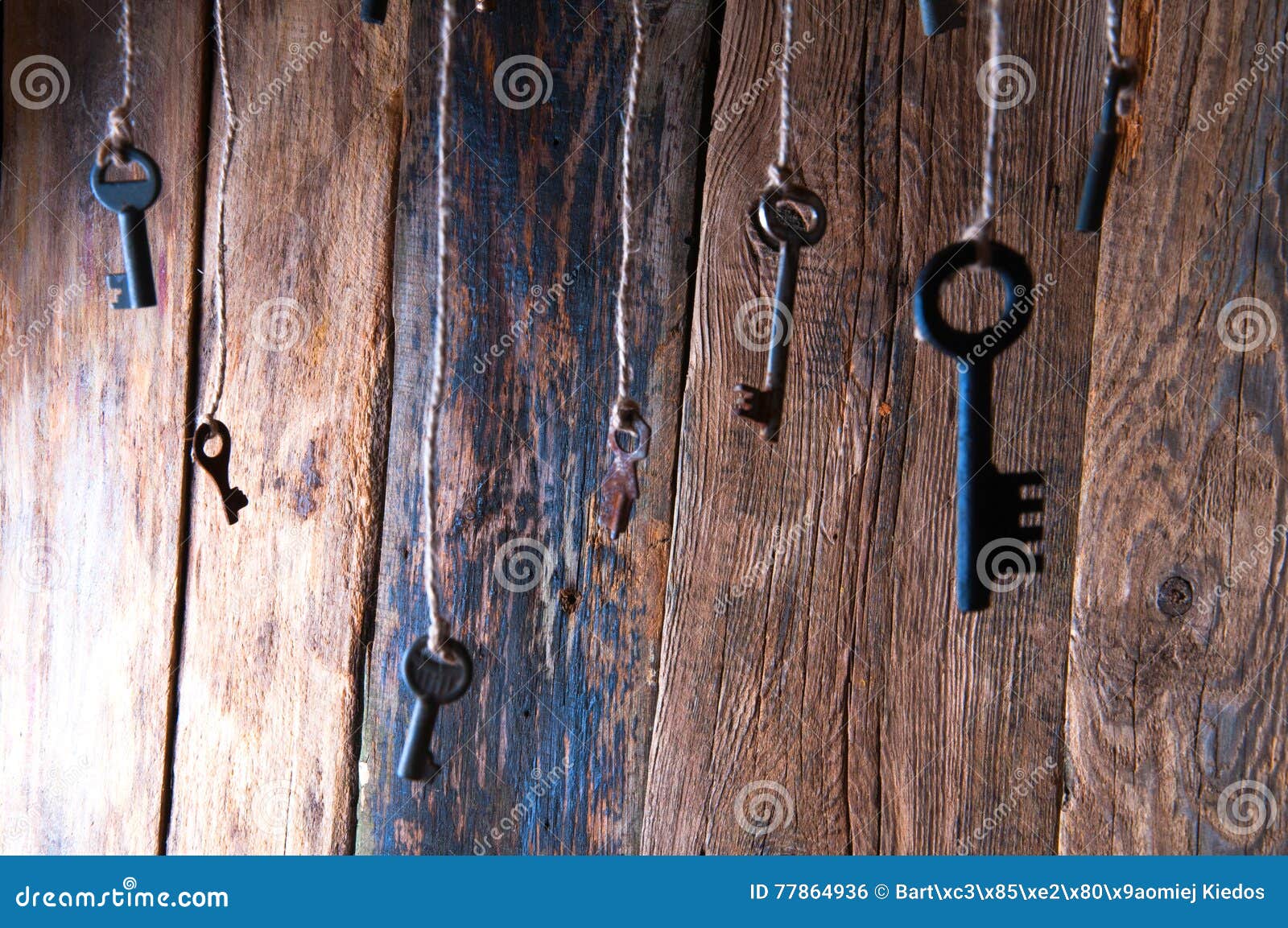 Many Keys Hanging on a String. Wooden Background Stock Photo - Image of ...
