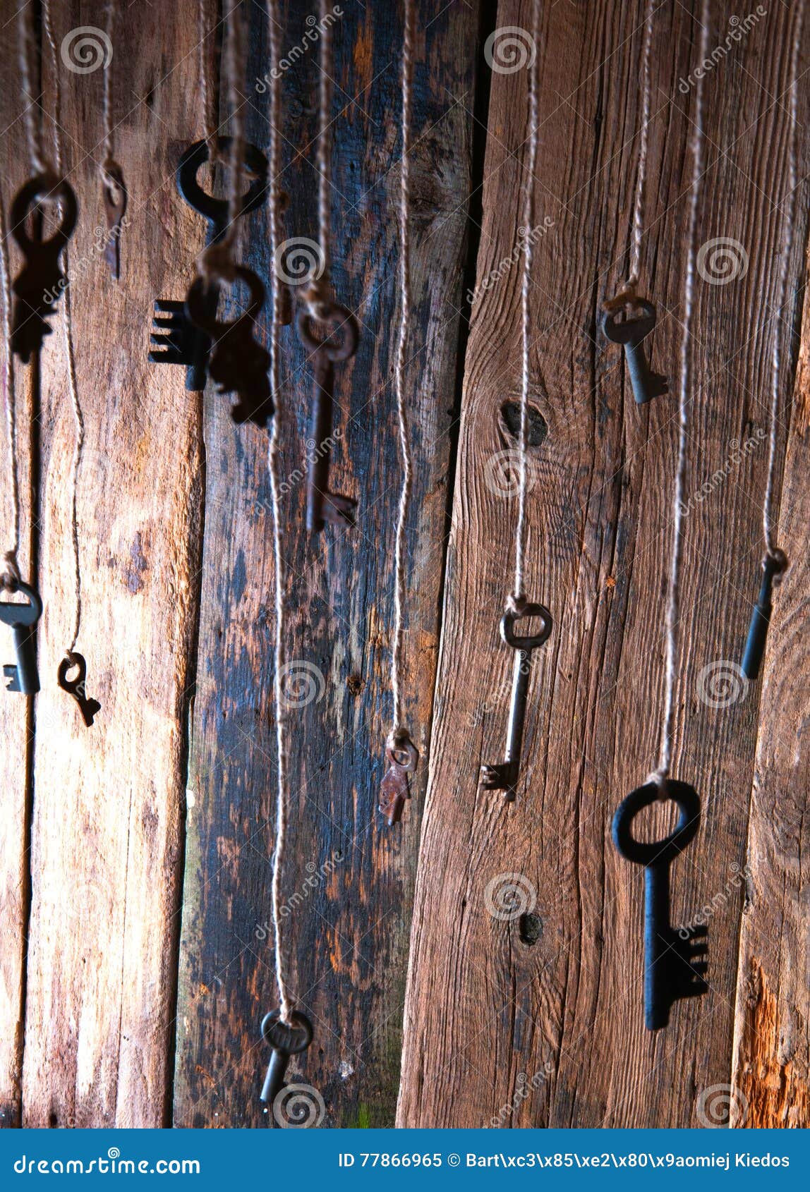 Many Keys Hanging on a String. Wooden Background Stock Image - Image of ...