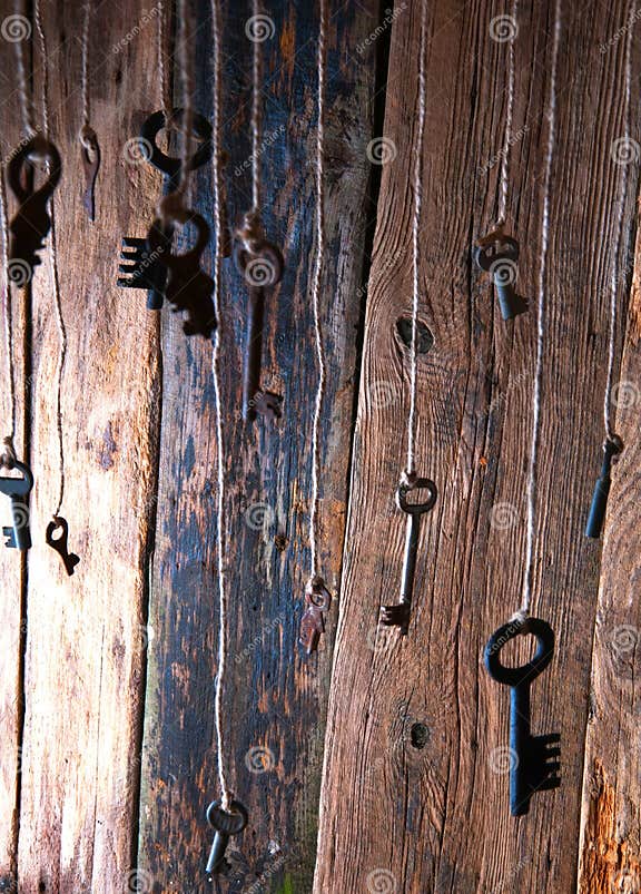 Many Keys Hanging on a String. Wooden Background Stock Image - Image of ...