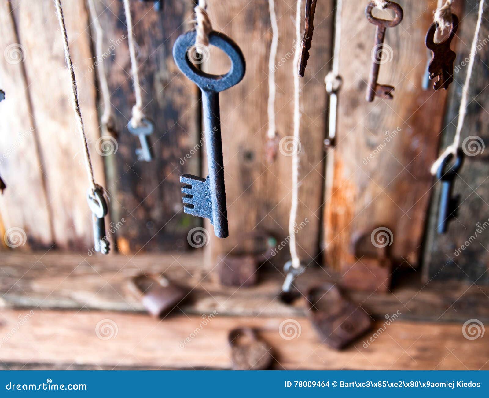 Many Keys Hanging on a String. Wooden Background Stock Photo - Image of ...