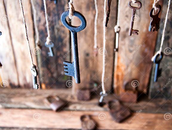 Many Keys Hanging on a String. Wooden Background Stock Photo - Image of ...