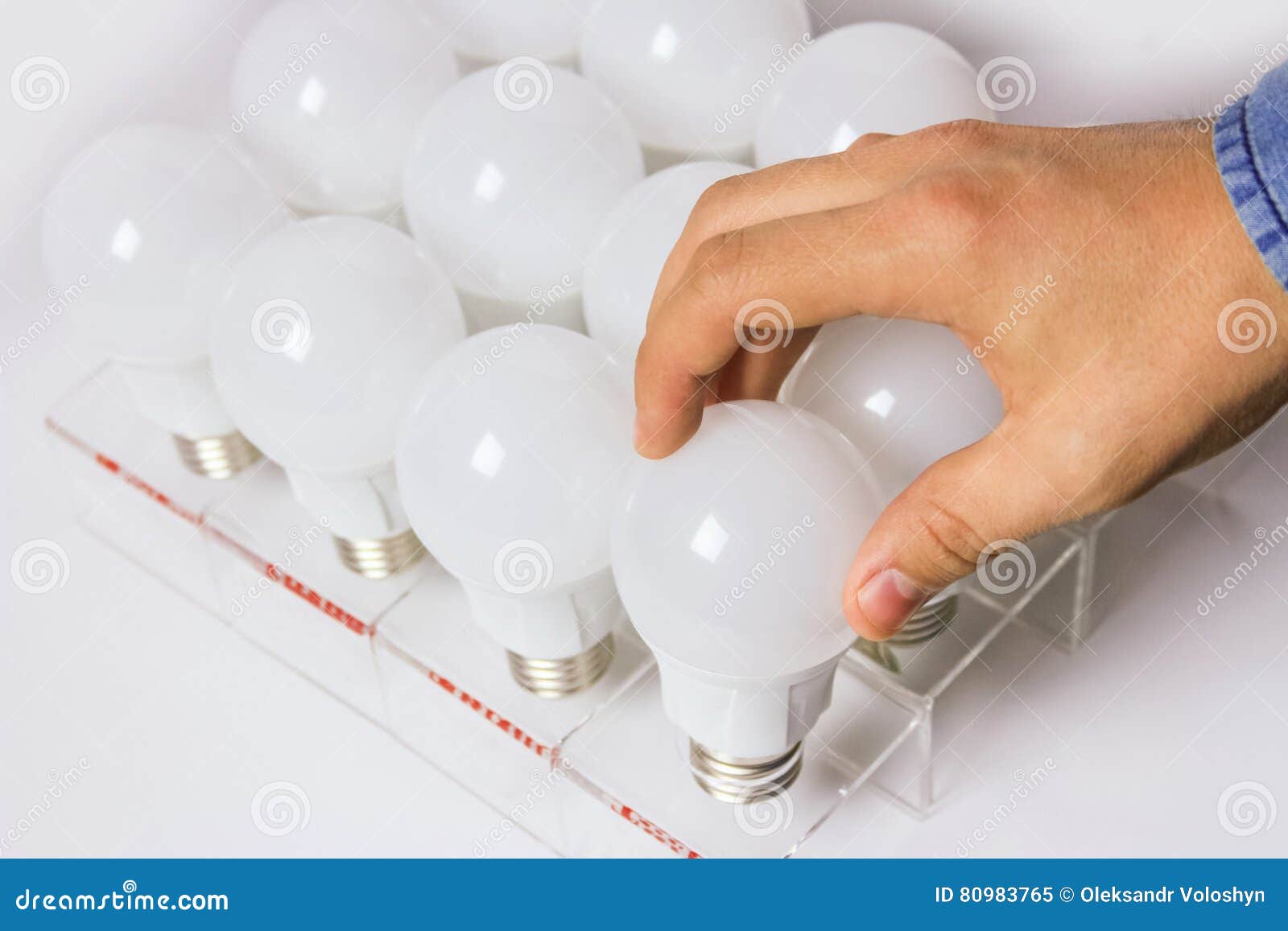 Many Led Lamps. Man`s Hand Unscrews the Light Bulb Stock Image - Image ...