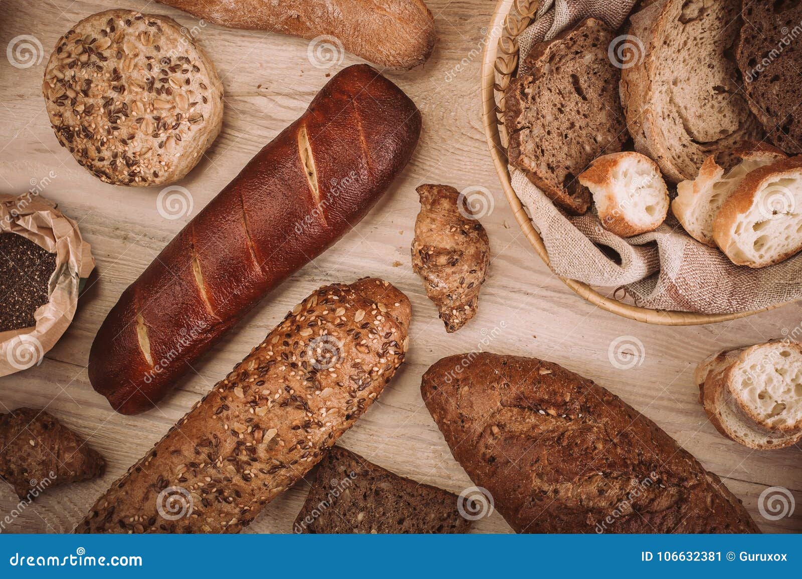 Many Mixed Baked Breads and Rolls on Rustic Wooden Table Stock Image ...