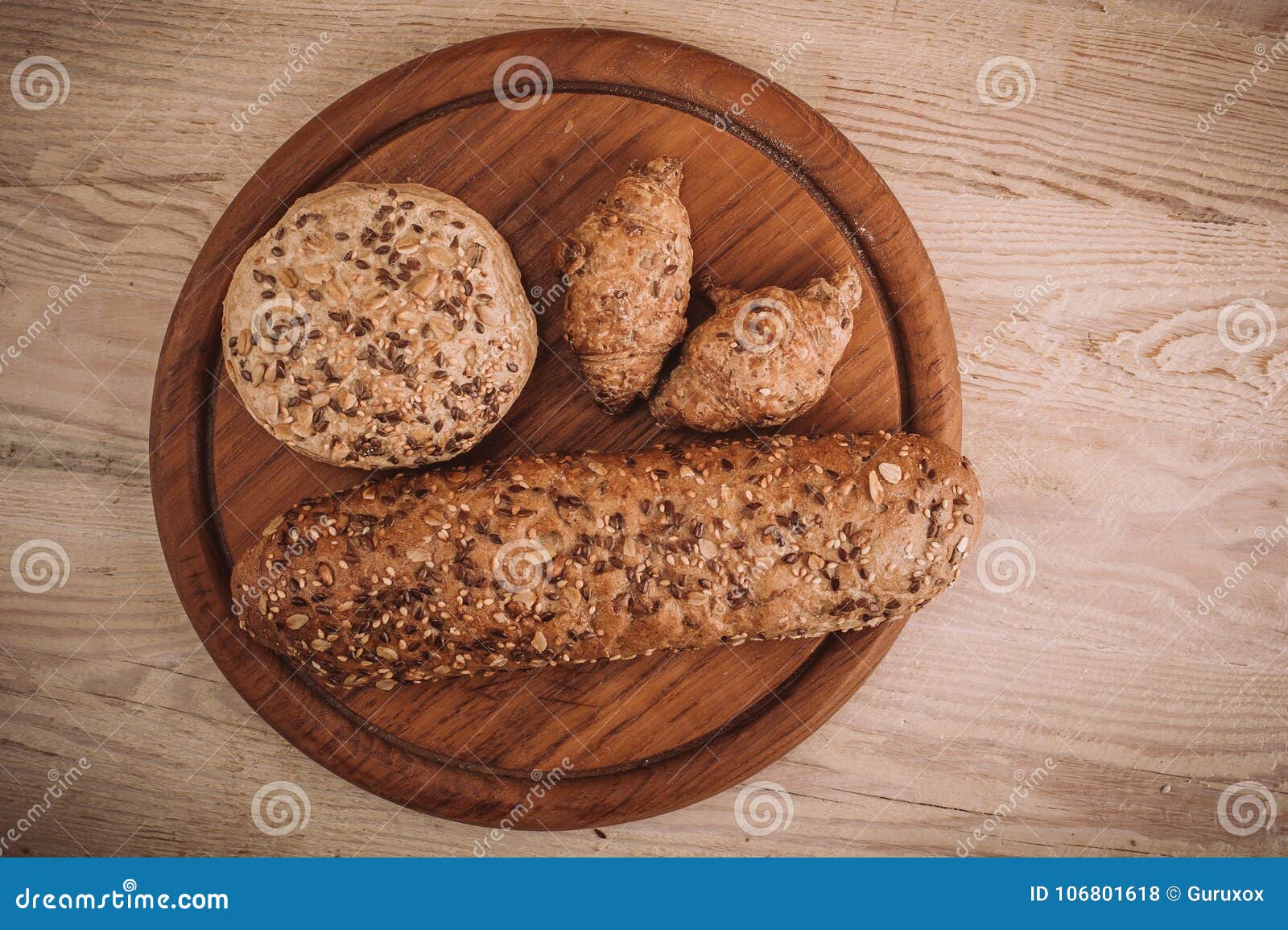 Many Mixed Baked Breads and Rolls on Rustic Wooden Table Stock Photo ...