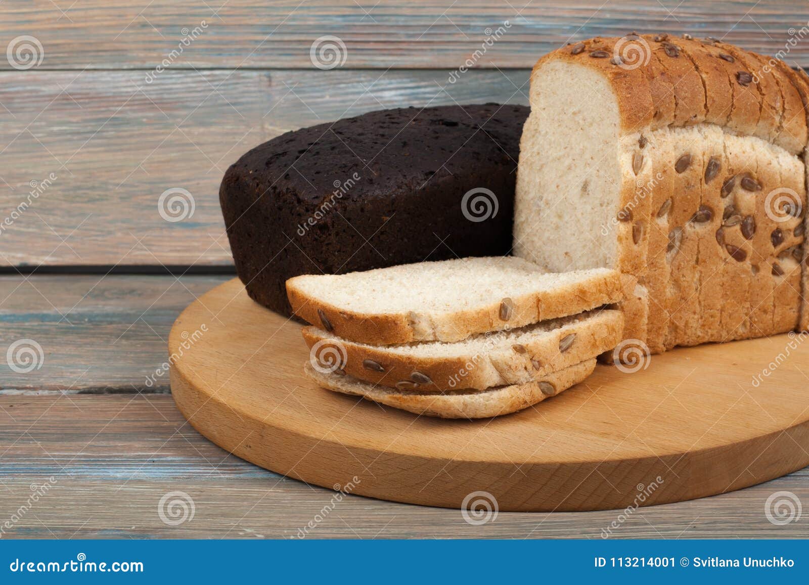 Many Mixed Breads and Rolls of Baked Bread on Wooden Table Background ...