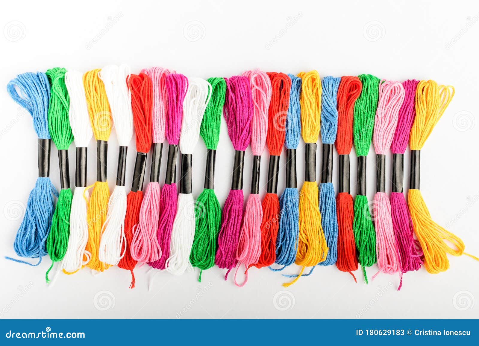 Many Mixed Vivid Colored Sewing Threads for Embroidery Displayed in a ...