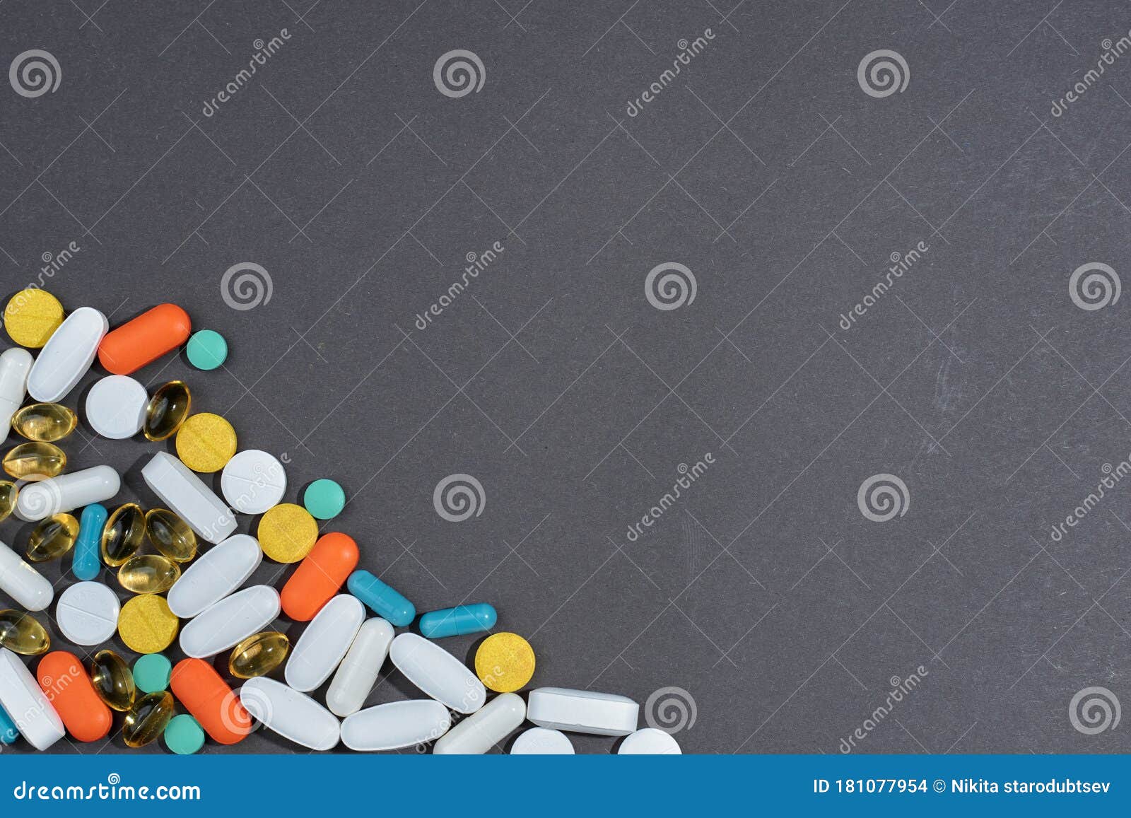 Many Multi-colored Tablets of Different Shapes in the Corner Against a ...