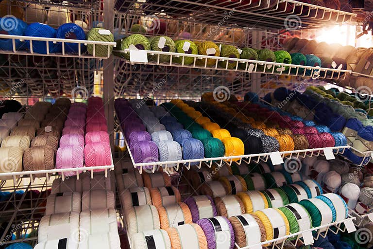 Many Multi-colored Threads on the Shelf Stock Photo - Image of threads ...