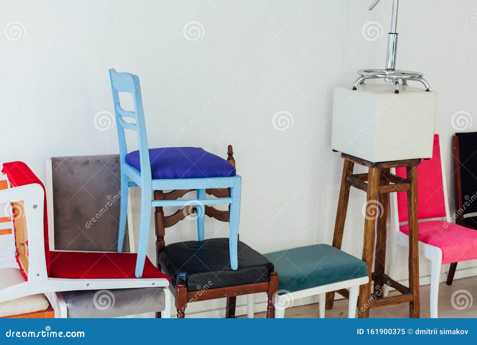 Many Multicolored Chairs in the Mess of the White Room Stock Image ...