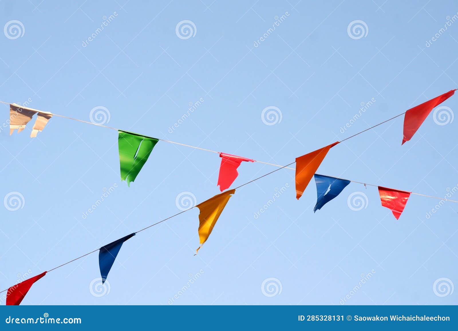 Many Multicolour Flags Hanging on a White Rope ,blue Sky Background ...
