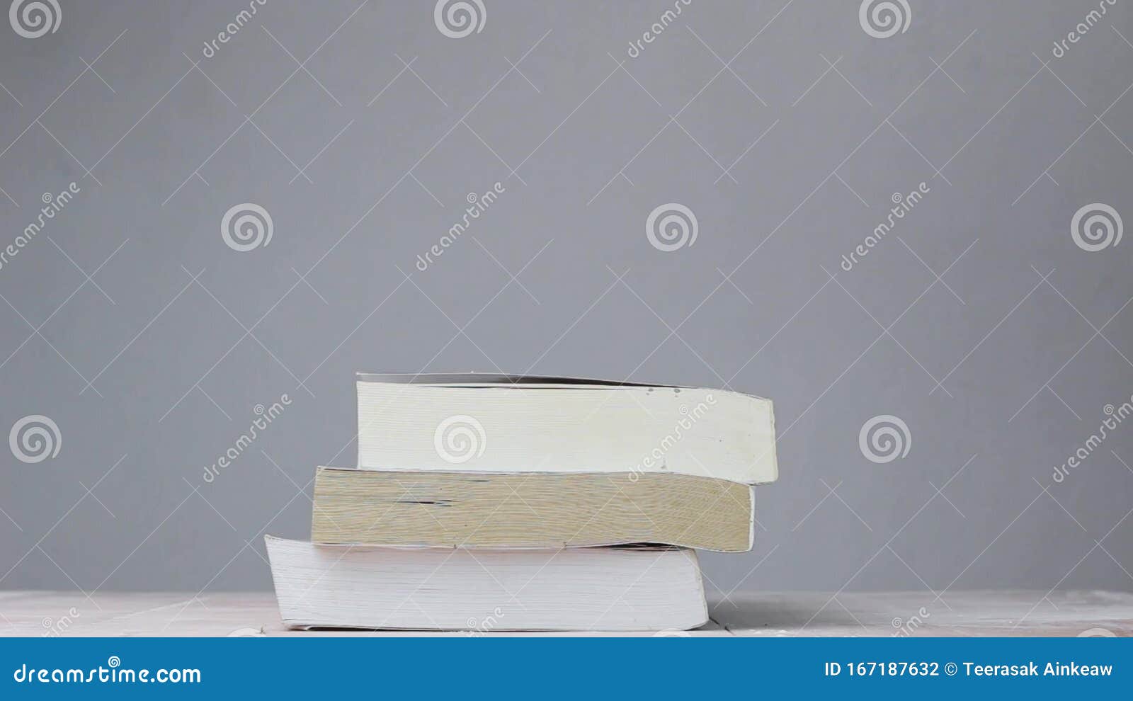 Many Old Books Falling on the Table and Spread Dust Throughout the Room ...