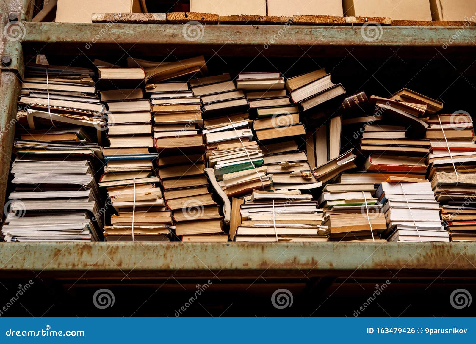 Many old books on a shelf stock photo. Image of office - 163479426