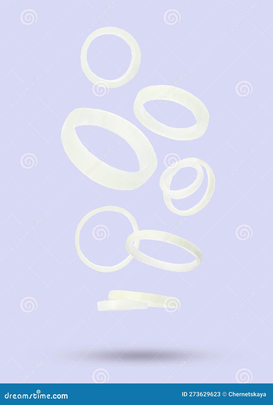 Many Onion Rings Falling on Pastel Light Violet Background Stock Image ...