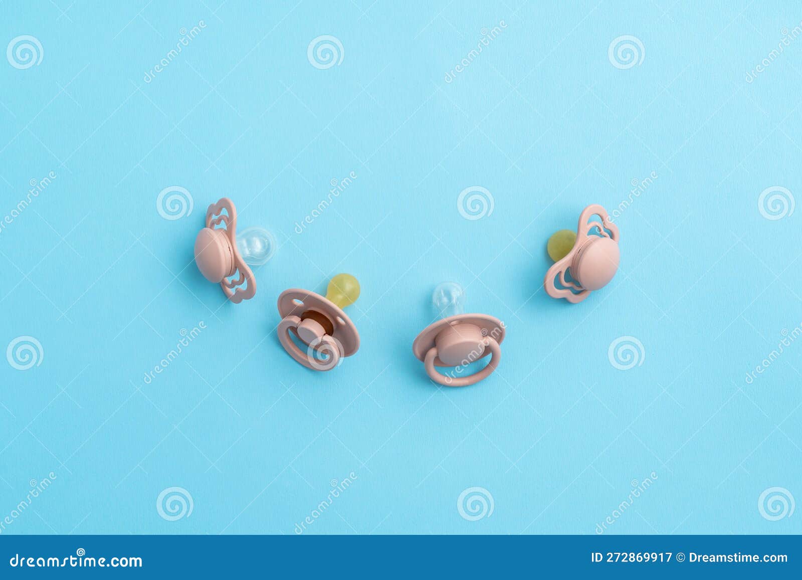 Pacifiers on Blue Background with Copy Space, Top View of Soothers ...