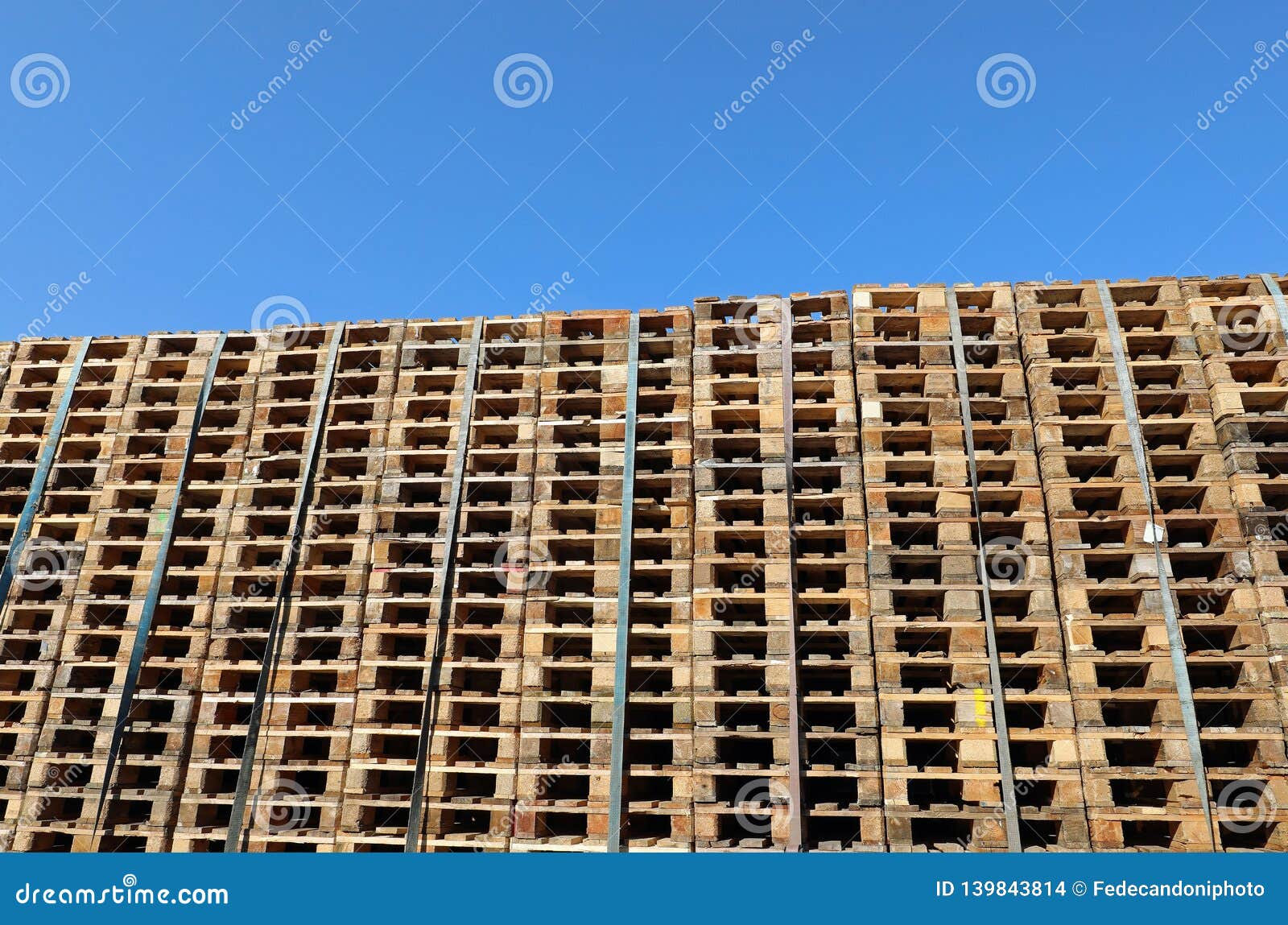 Many pallets and blue sky stock photo. Image of timber - 139843814