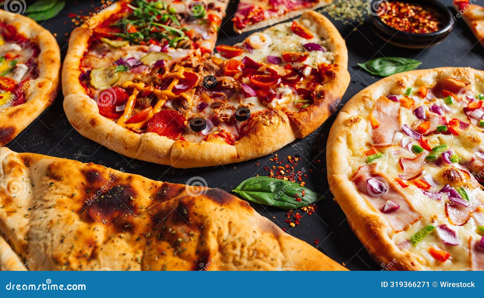 Many Pizzas with Different Toppings Sitting on a Table Stock Image ...