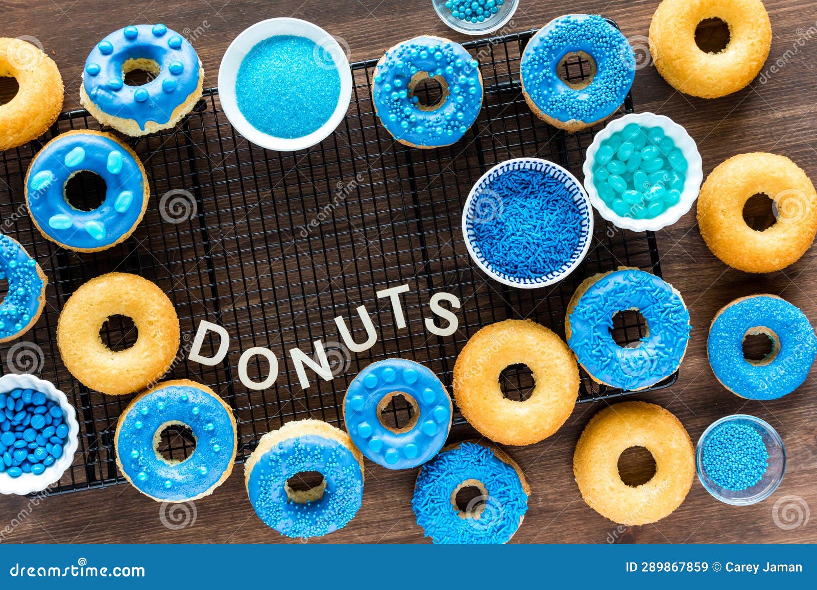 Many Plain and Blue Chocolate Dipped Donuts on a Cooling Rack with ...