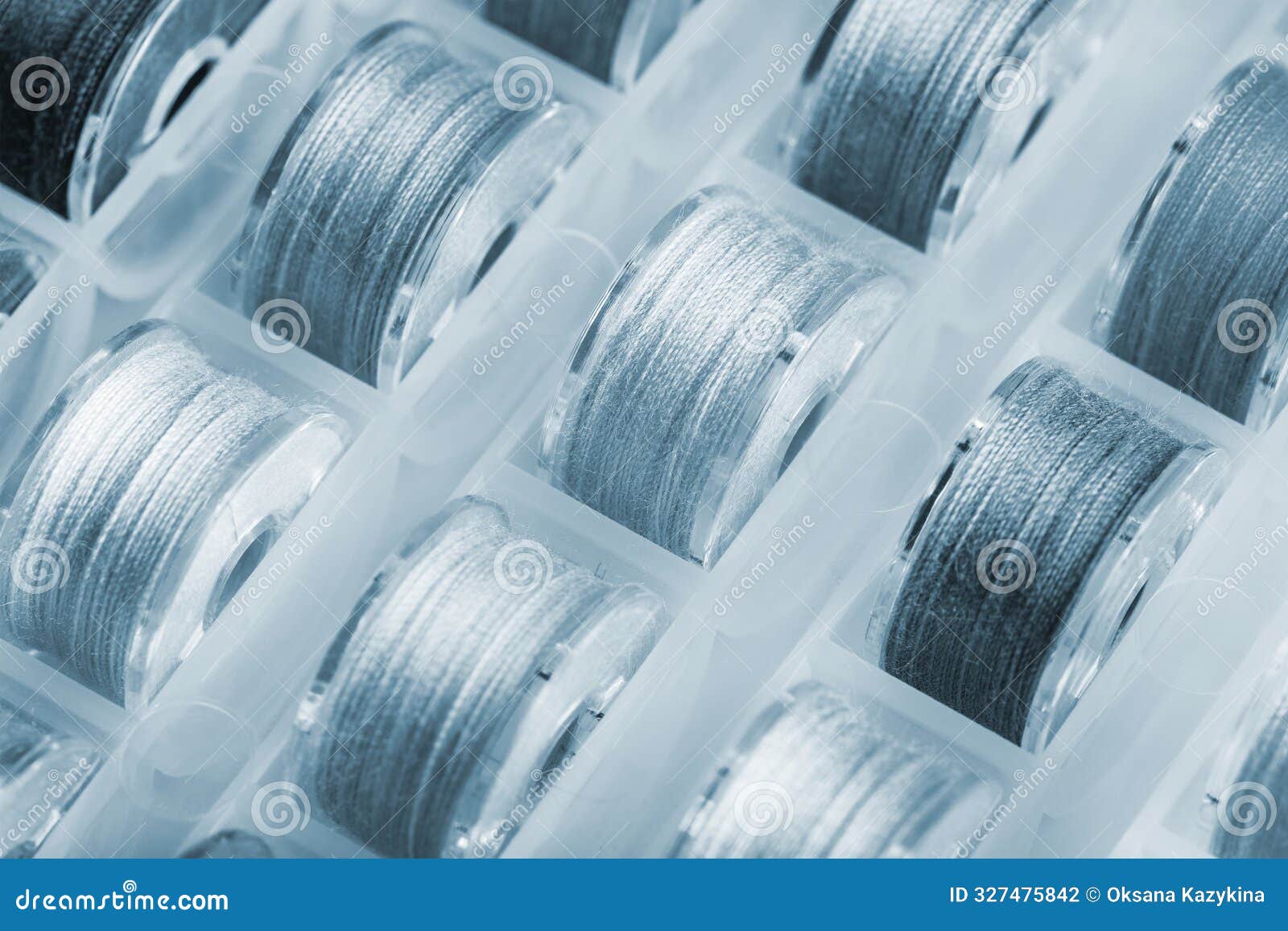 Many Plastic Bobbins for Sewing Machine in a Box Stock Photo - Image of ...
