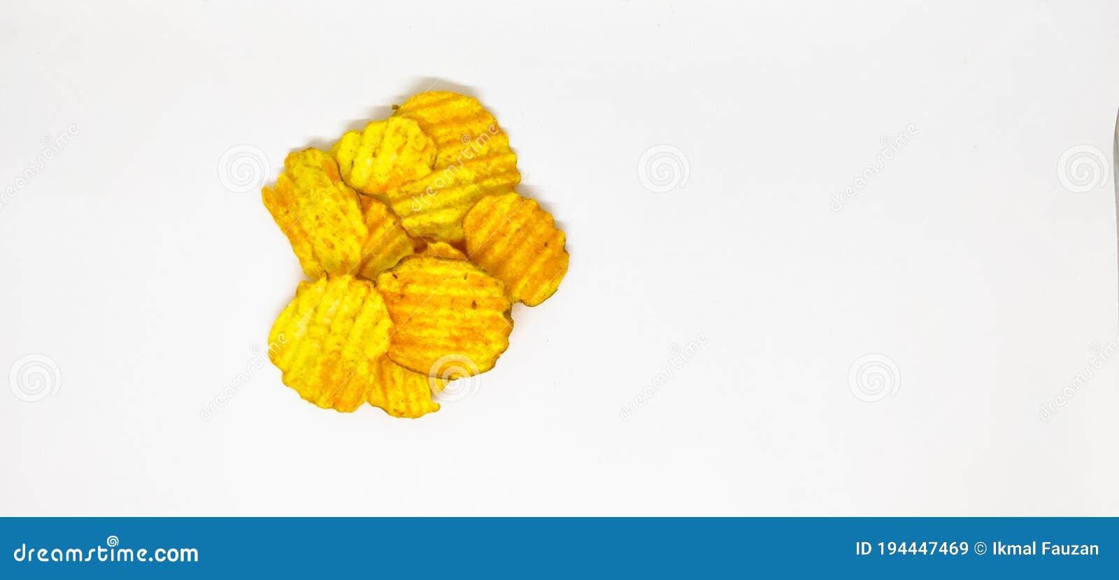 Many Potato Chips Poured Out Of Shiny Packaging On Blue Background ...