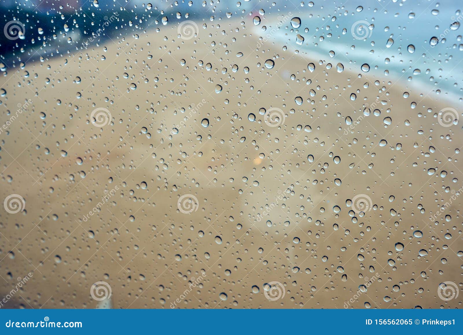 Many Rain Drops on the Window with a Blurred View of the Beach Stock ...