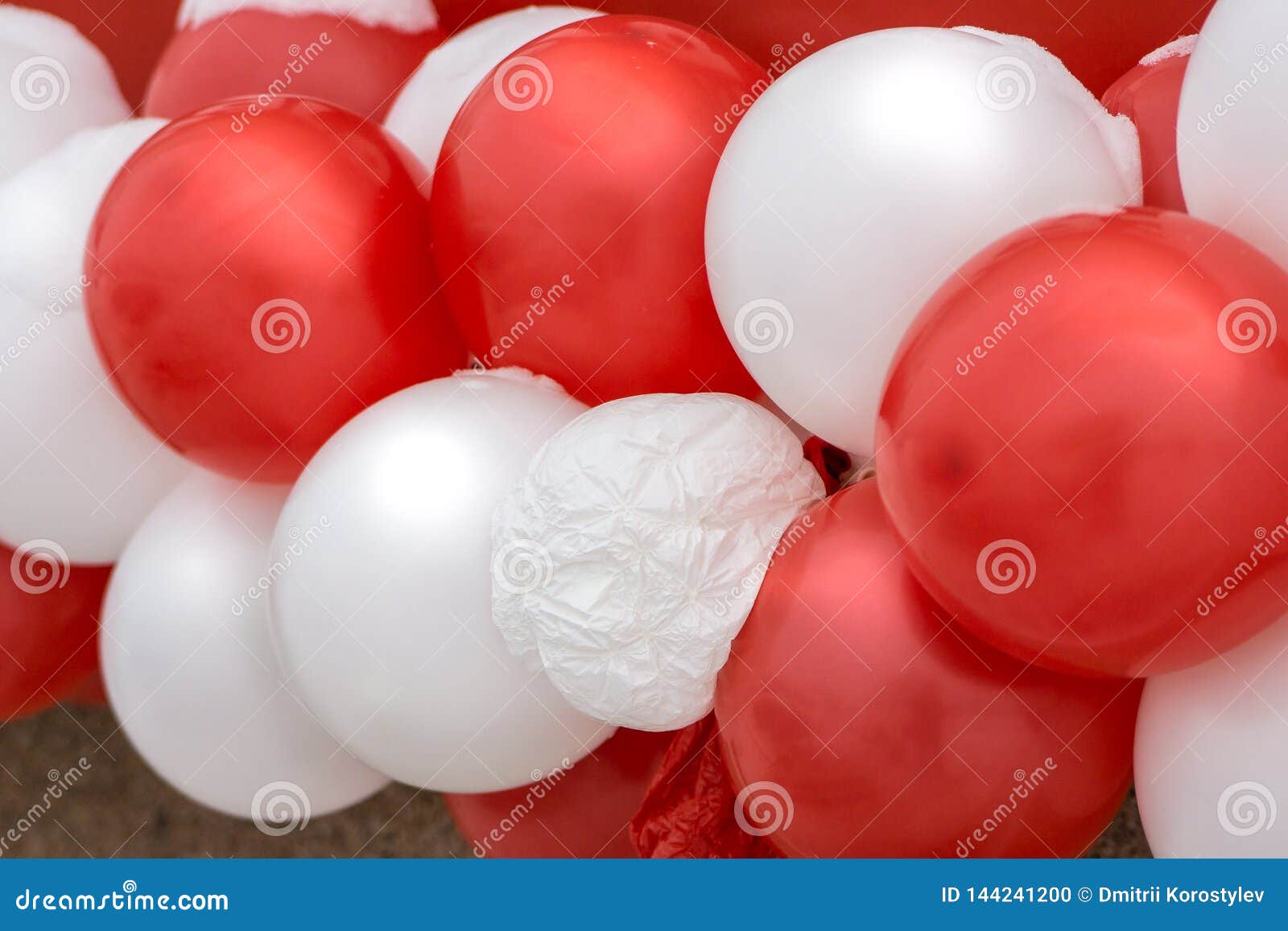 Among the Many Red and White Balloons One Deflated Stock Photo - Image ...