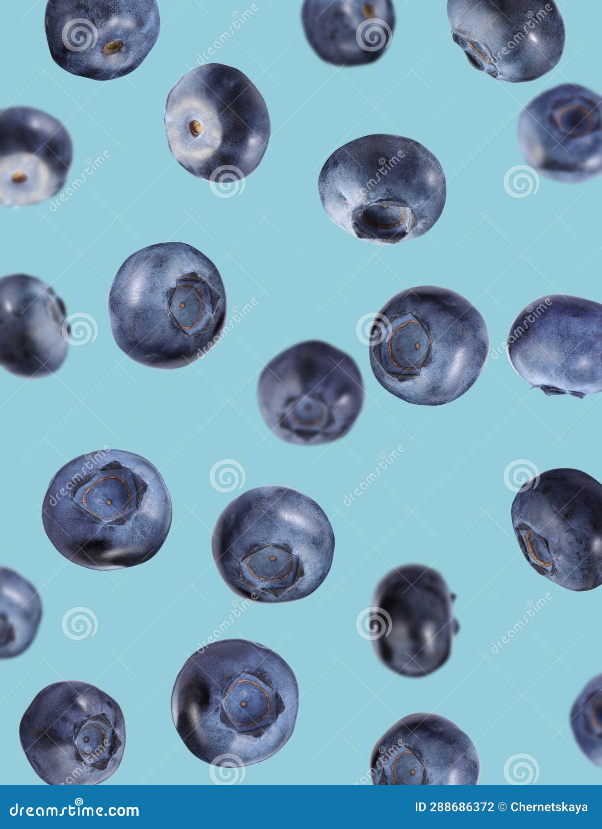 Many Ripe Blueberries Falling on Light Blue Background Stock Photo ...