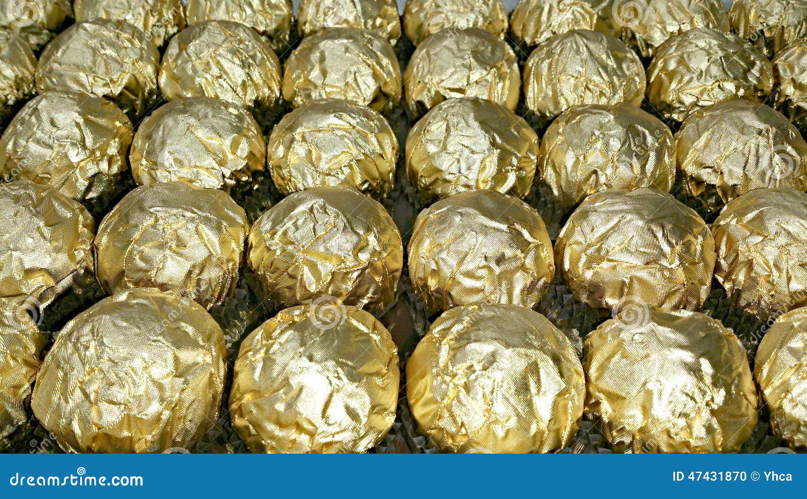 Many Rows of Golden Wrappers Stock Photo - Image of delicate, foil ...