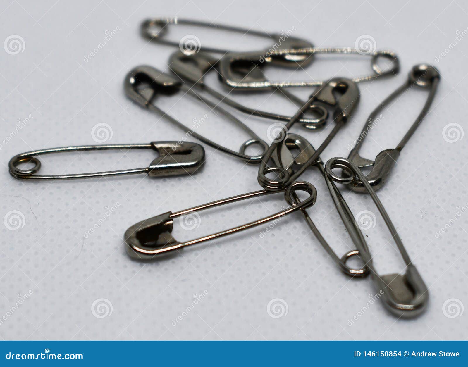 Many safety pins together stock photo. Image of sharp - 146150854
