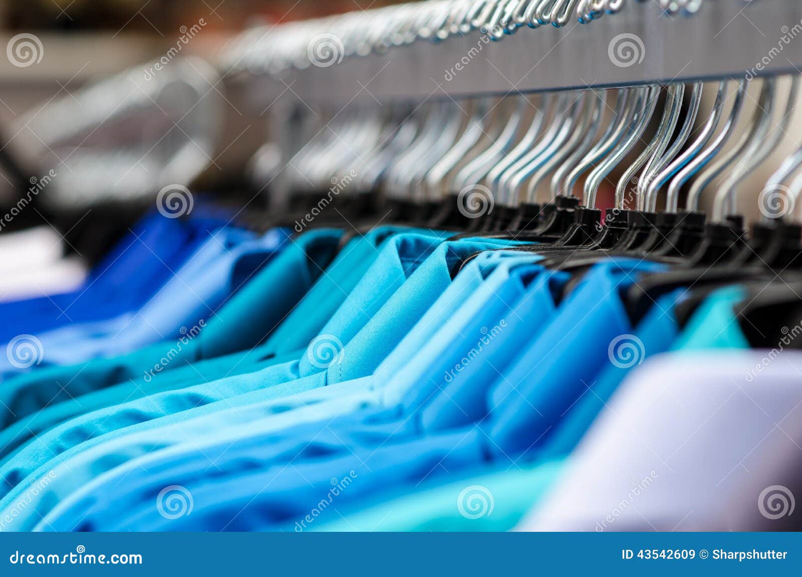 Many shirts hanging stock image. Image of rack, green - 43542609