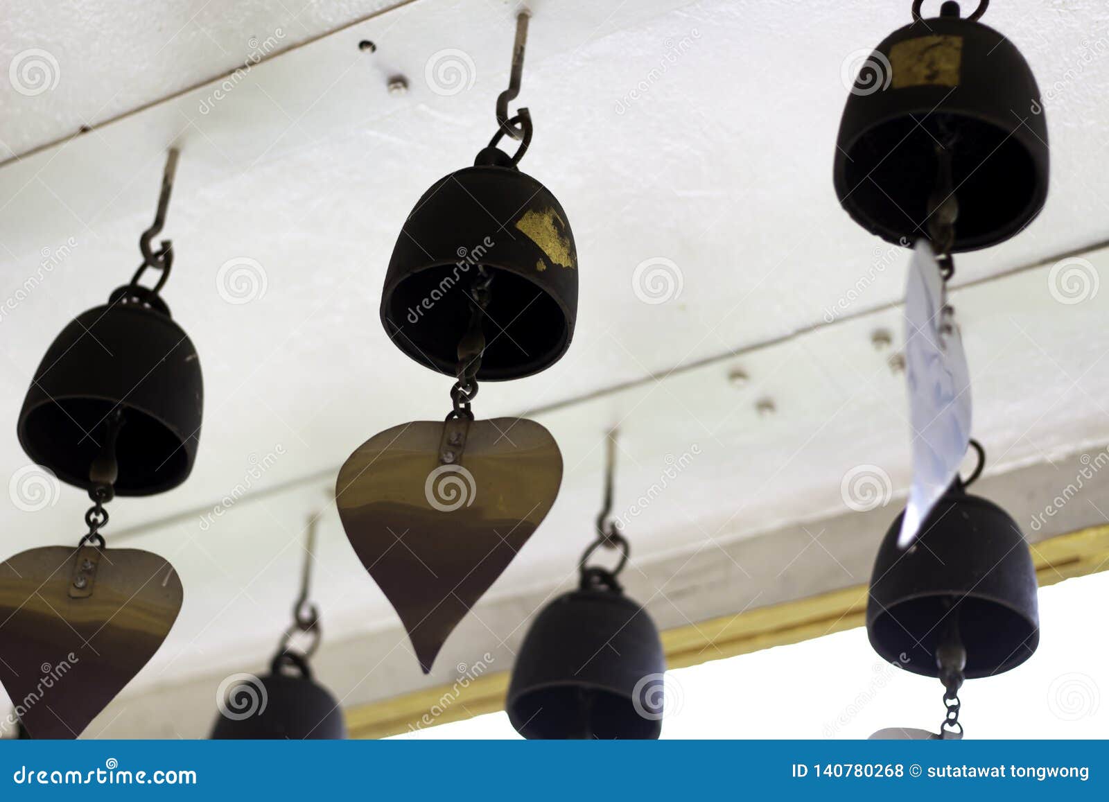 Many Small Bells Hang on the Wall Stock Photo - Image of shiny, style ...
