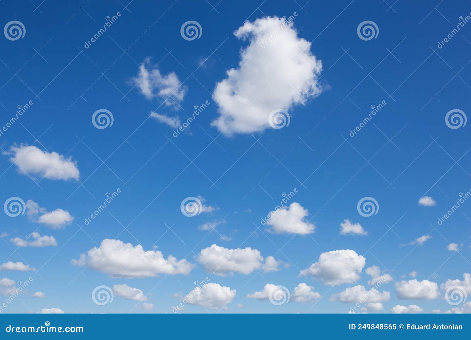 Many Small Cumulus Clouds, Against the Blue Sky, One Cloud is Separate ...