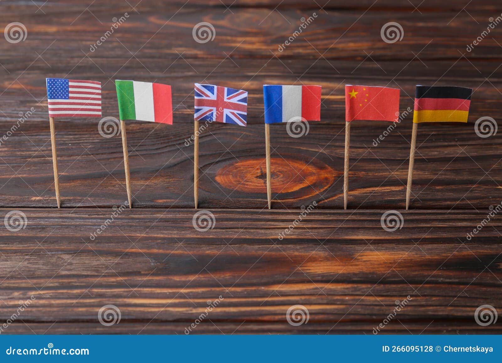 Many Small Paper Flags of Different Countries on Wooden Table Stock ...