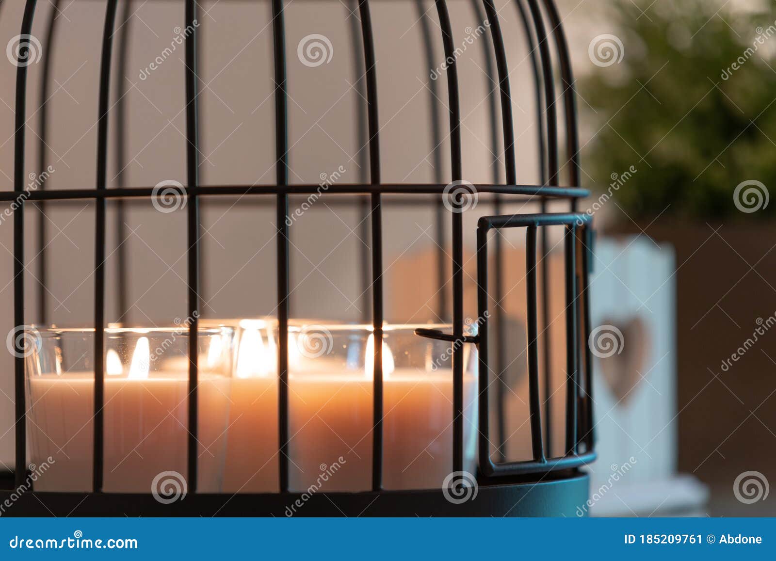 Scented Lit Candles in a Decorative Cage Stock Image - Image of glass ...