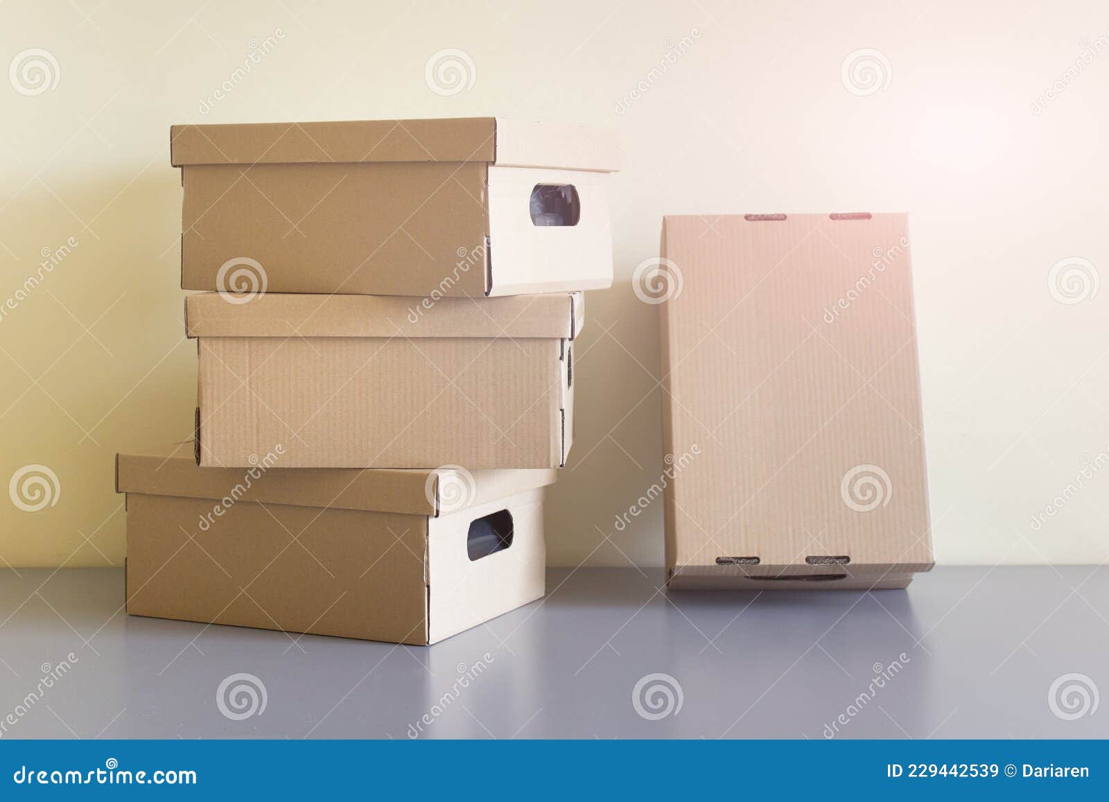 Stacked Brown Carton Boxes Laying on Table Stock Image - Image of blank ...