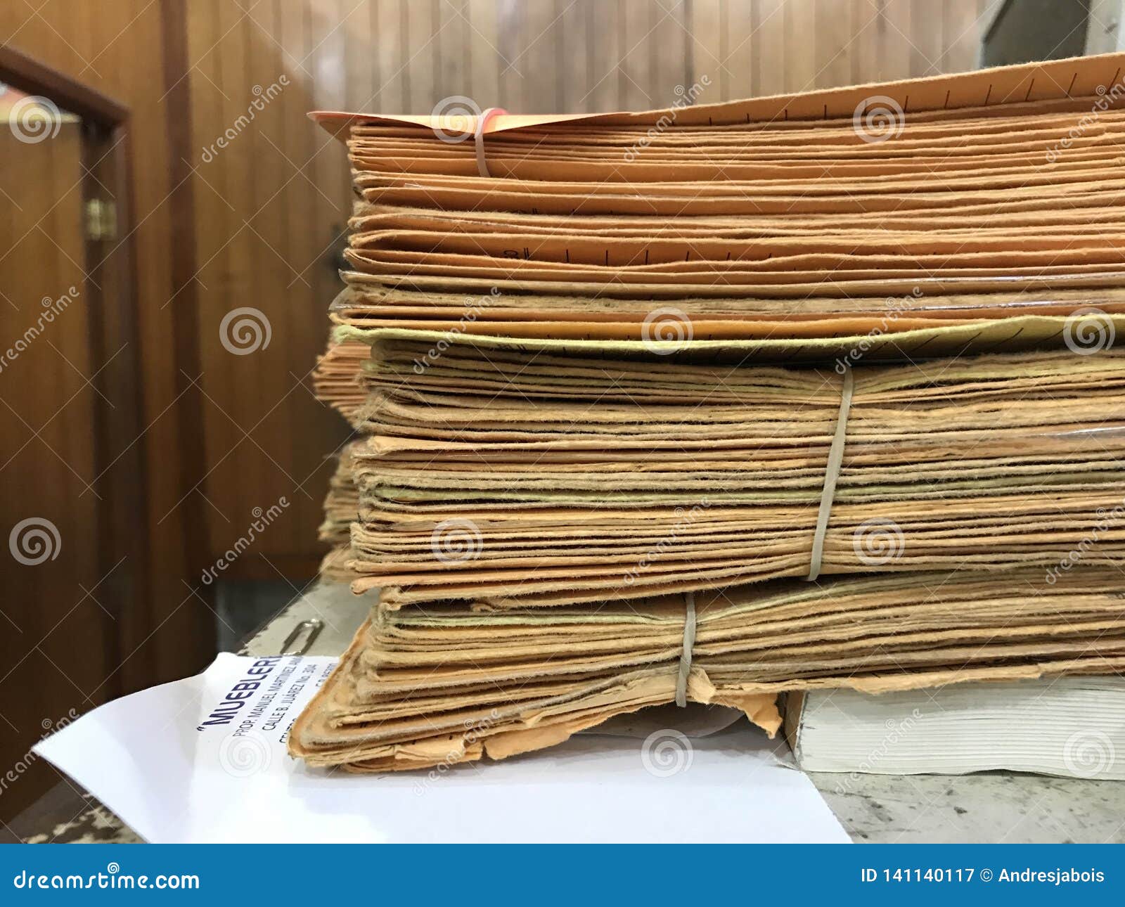 Many Stacked Yellow Envelopes Separated into Packages with Rubber Bands ...